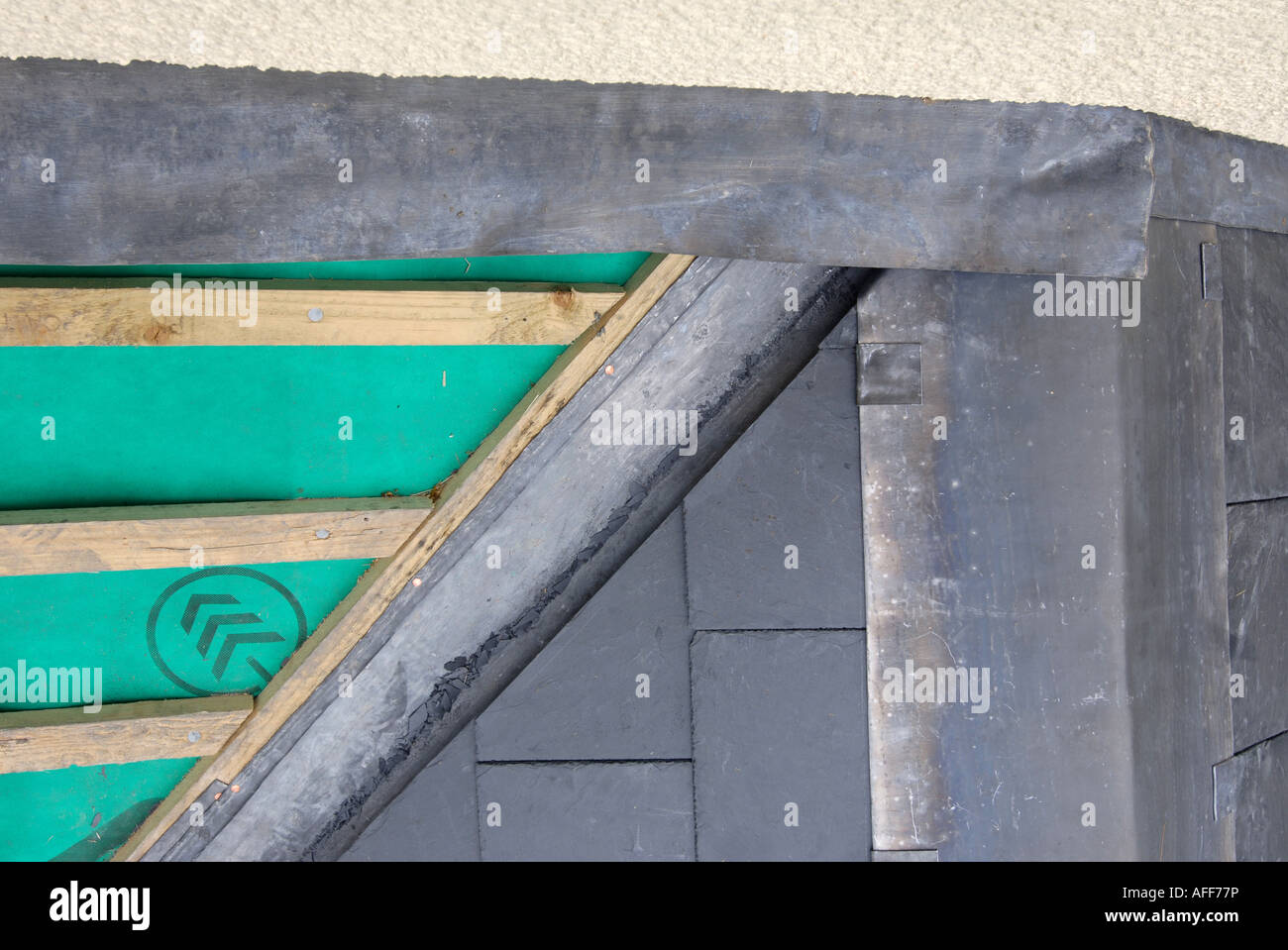 THE SECTION OF A SLATE ROOF UNDER CONSTRUCTION SHOWING THE BREATHABLE ...