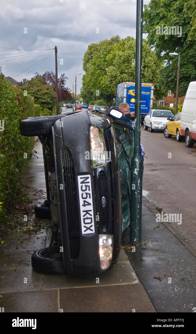 Overturned car on pavement London England Stock Photo - Alamy