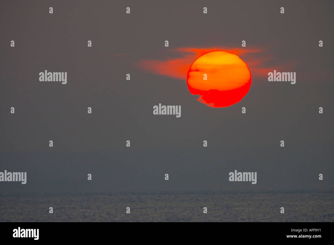 large sunrise over sea isle of wight england uk Stock Photo - Alamy