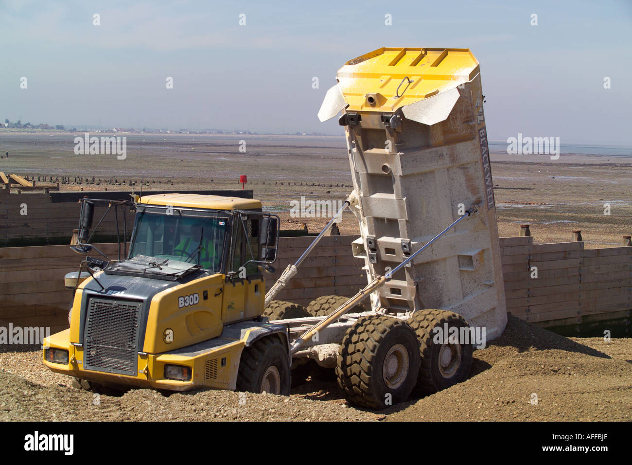 Sea defence building in whitstable kent raising the level of the beach ...