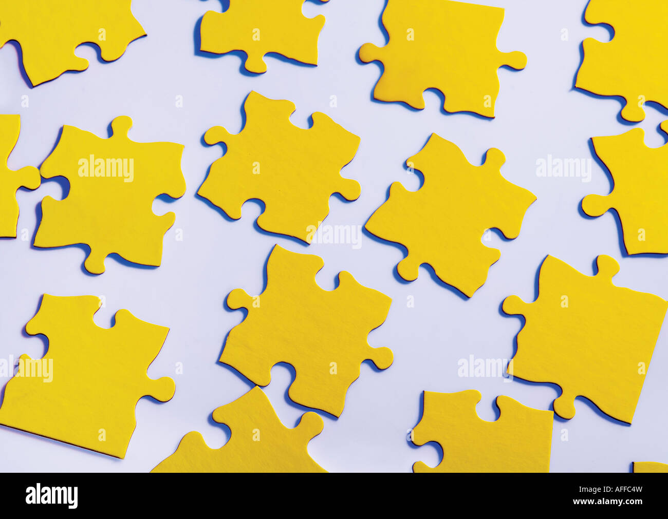 Yellow puzzle pieces Stock Photo - Alamy