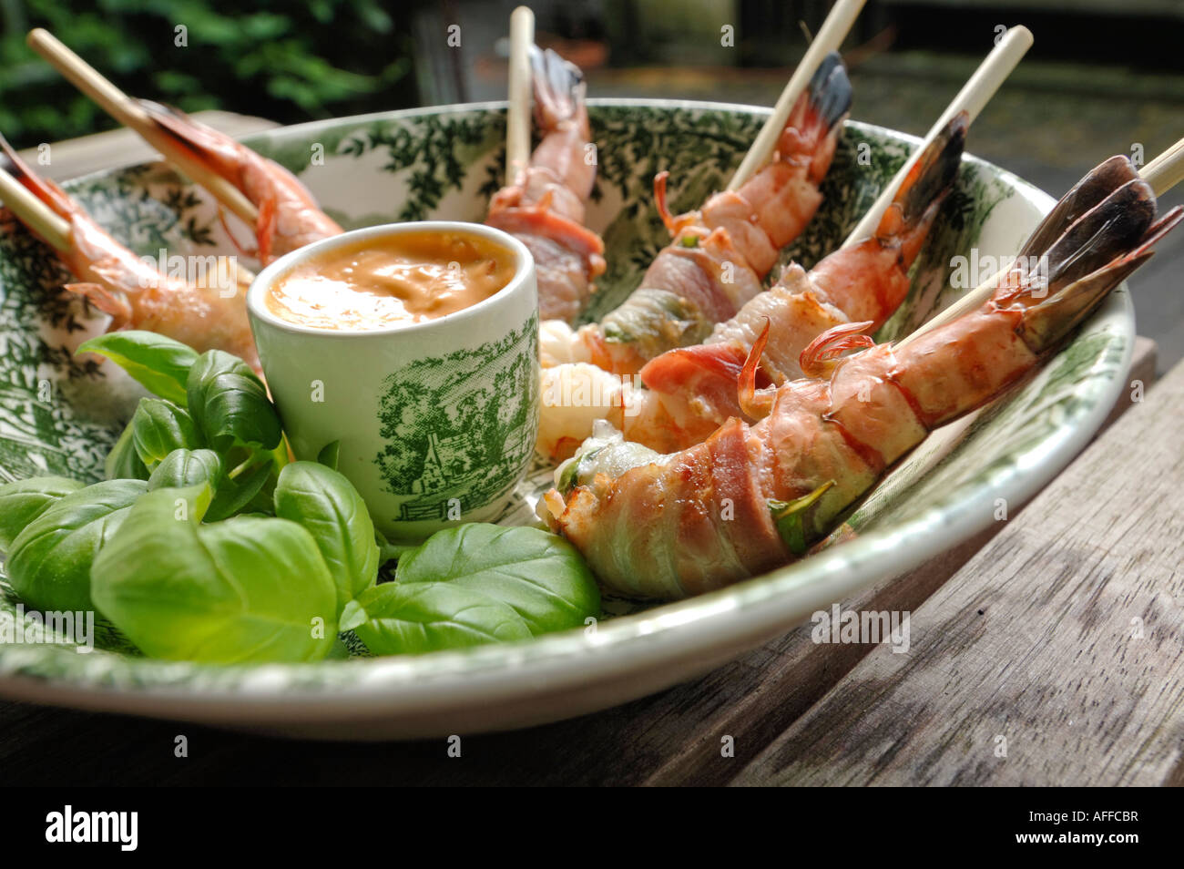 Barbecued prawns wrapped in bacon Stock Photo - Alamy