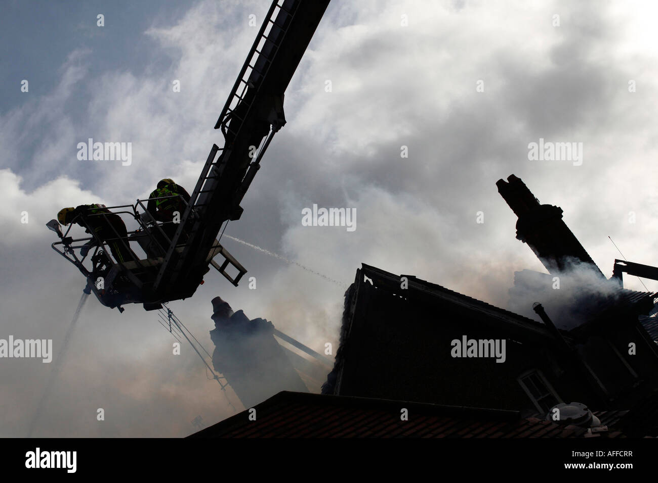 Crane smoke damage fireman danger hi-res stock photography and images ...