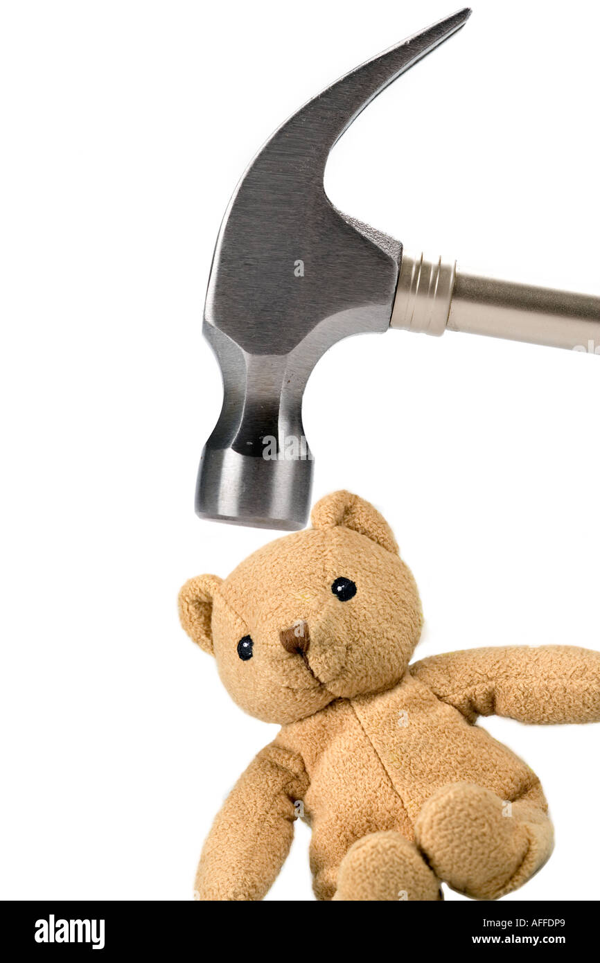 Hitting teddy bear on head with hammer Stock Photo - Alamy