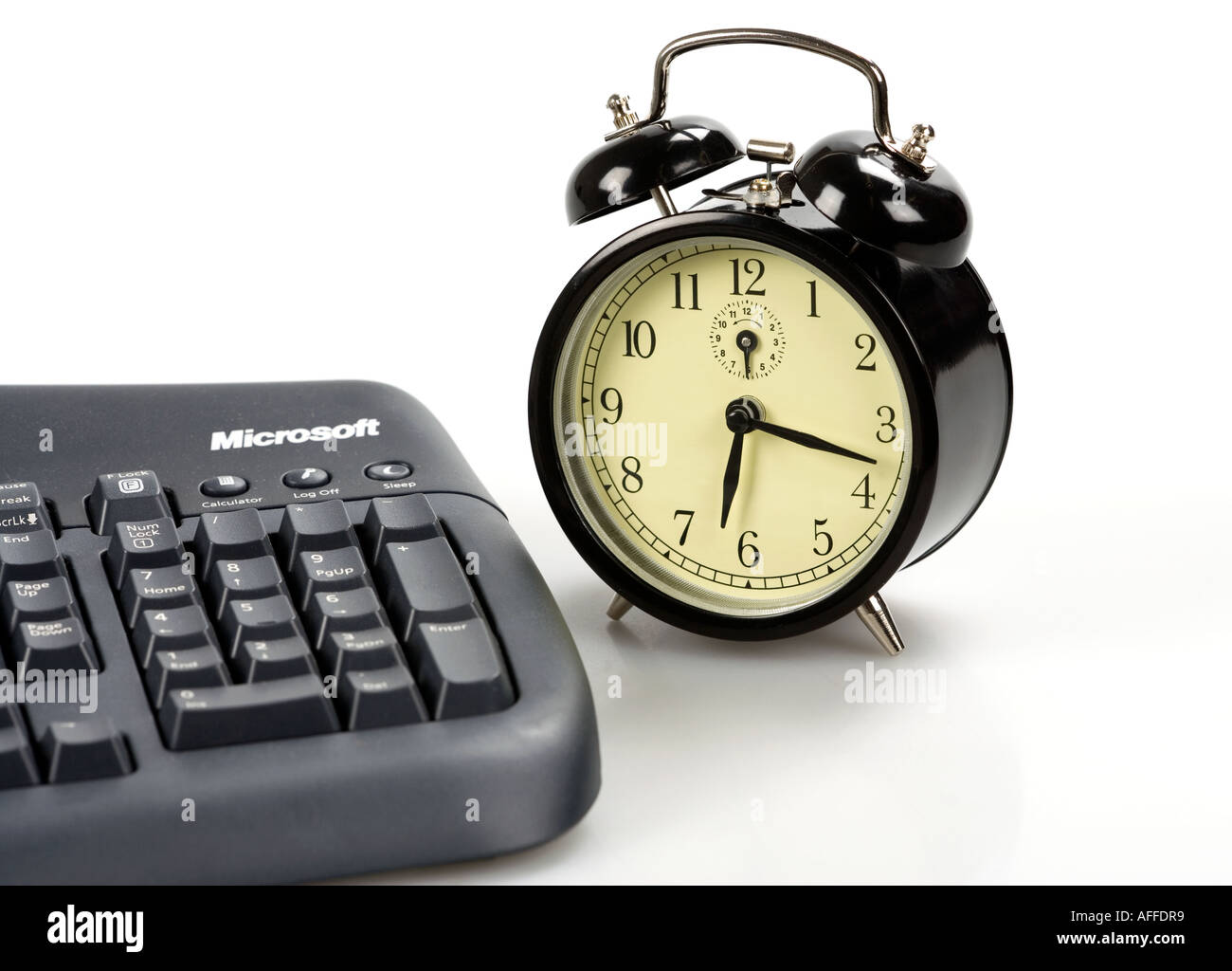 Alarm Clock and keyboard Stock Photo - Alamy