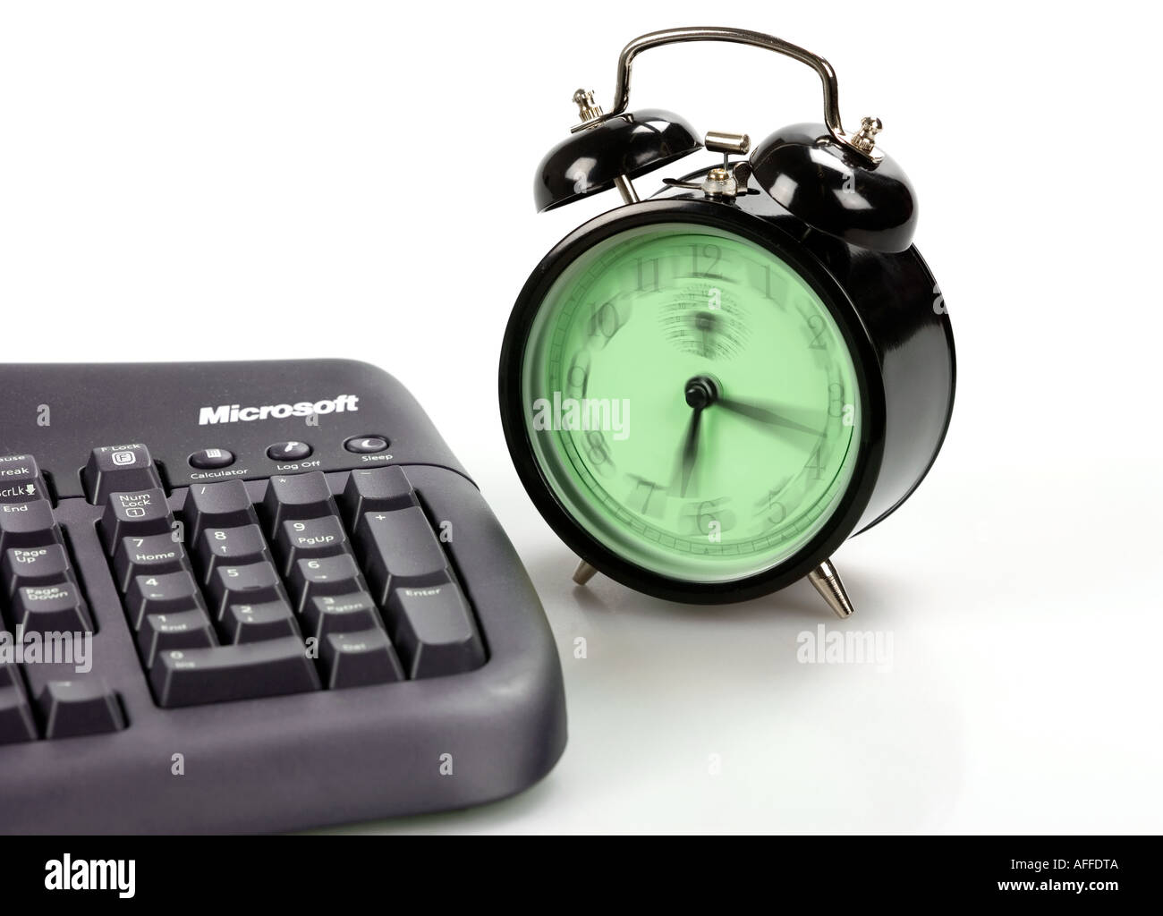 Alarm Clock and keyboard with fastforward time Stock Photo - Alamy