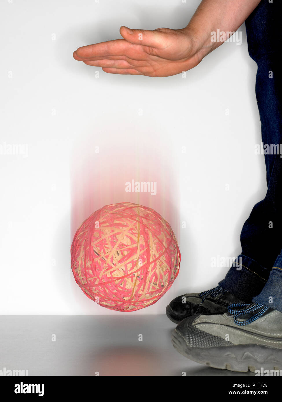 dropping a rubber band ball Stock Photo - Alamy
