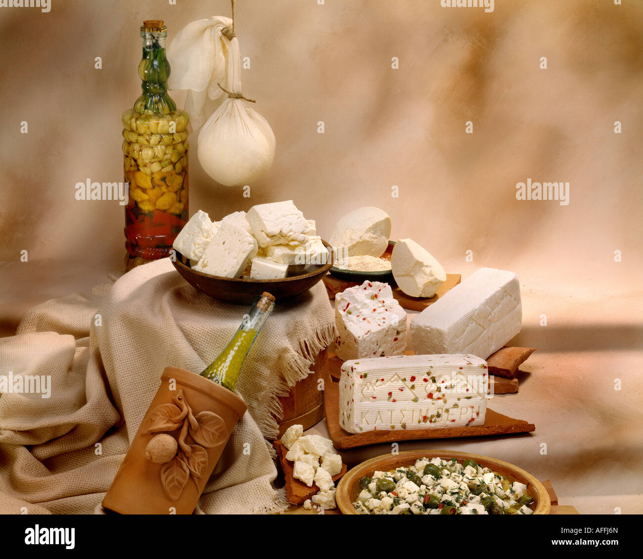 Greek Cheeses in group photograph on tan toned mottled background ...