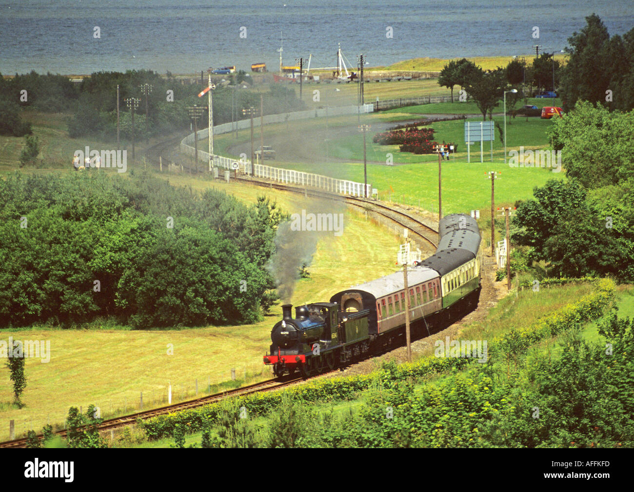 Bo'ness and Kinneil Railway steam train passing along the foreshore at ...