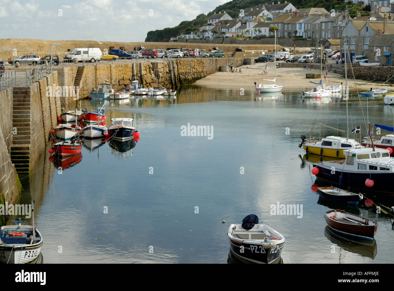 Mousehole harbour West Cornwall fishing boats at the quayside Stock ...