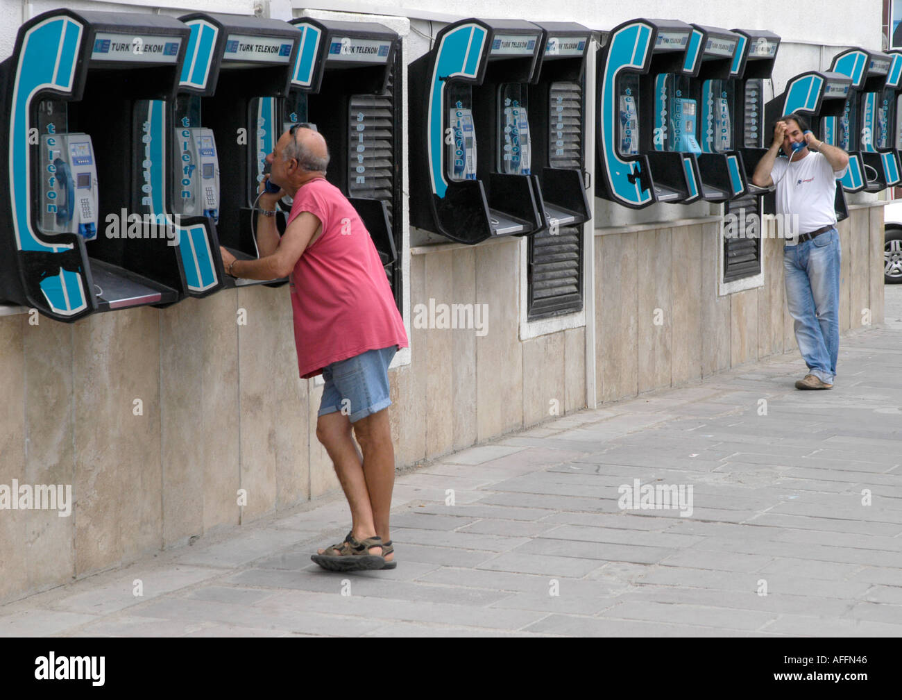 Using a public telephone on the streets of Bodrum in Turkey Stock Photo ...