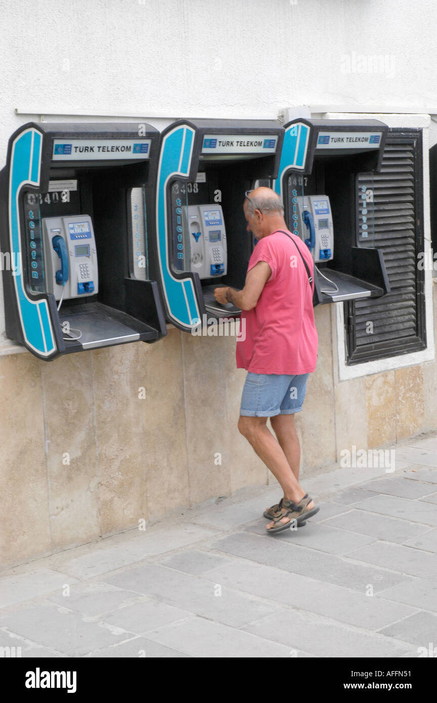 Using a public telephone on the streets of Bodrum in Turkey Stock Photo ...