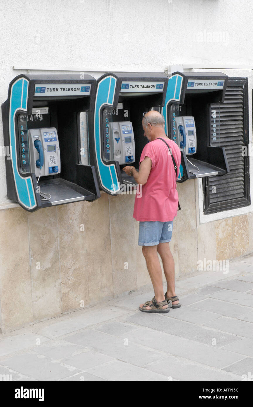 Using a public telephone on the streets of Bodrum in Turkey Stock Photo ...