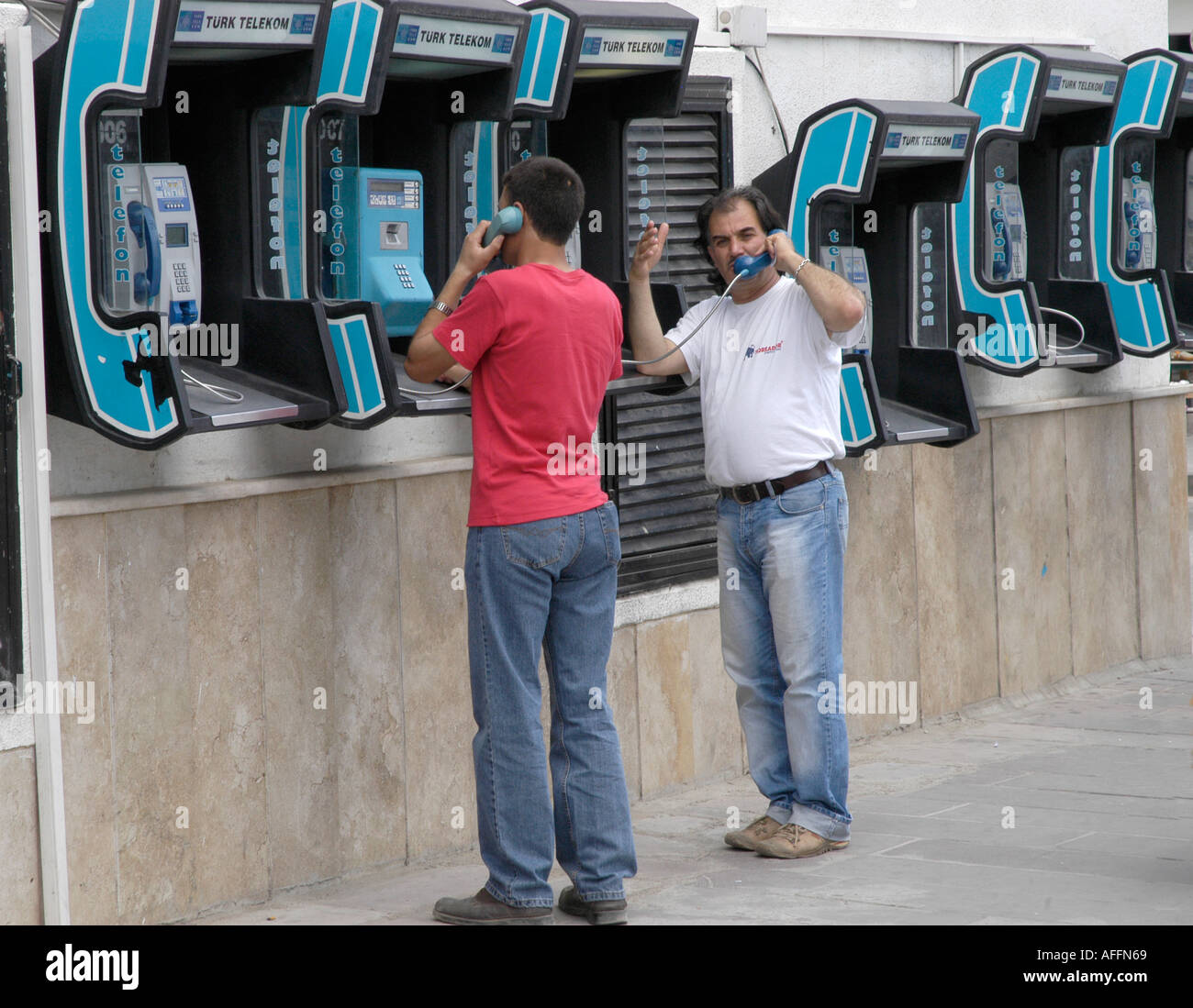 Using a public telephone on the streets of Bodrum in Turkey Stock Photo ...