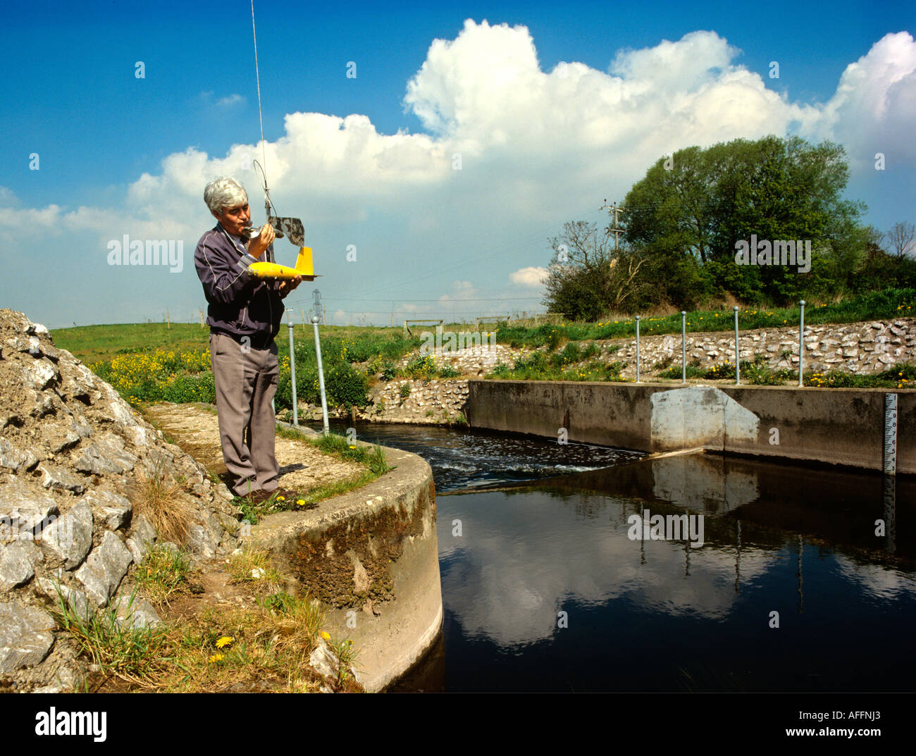 Water Industry Environment Agency Officer at weir flow measuring ...