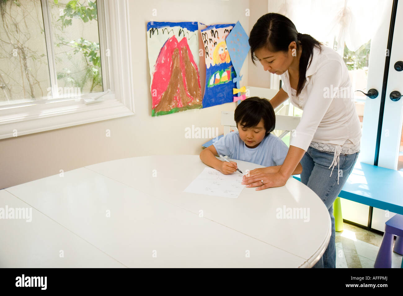 Mother Helps her Son with his Homework Stock Photo - Alamy Mother Helps her Son with his Homework Stock Photo - Alamy