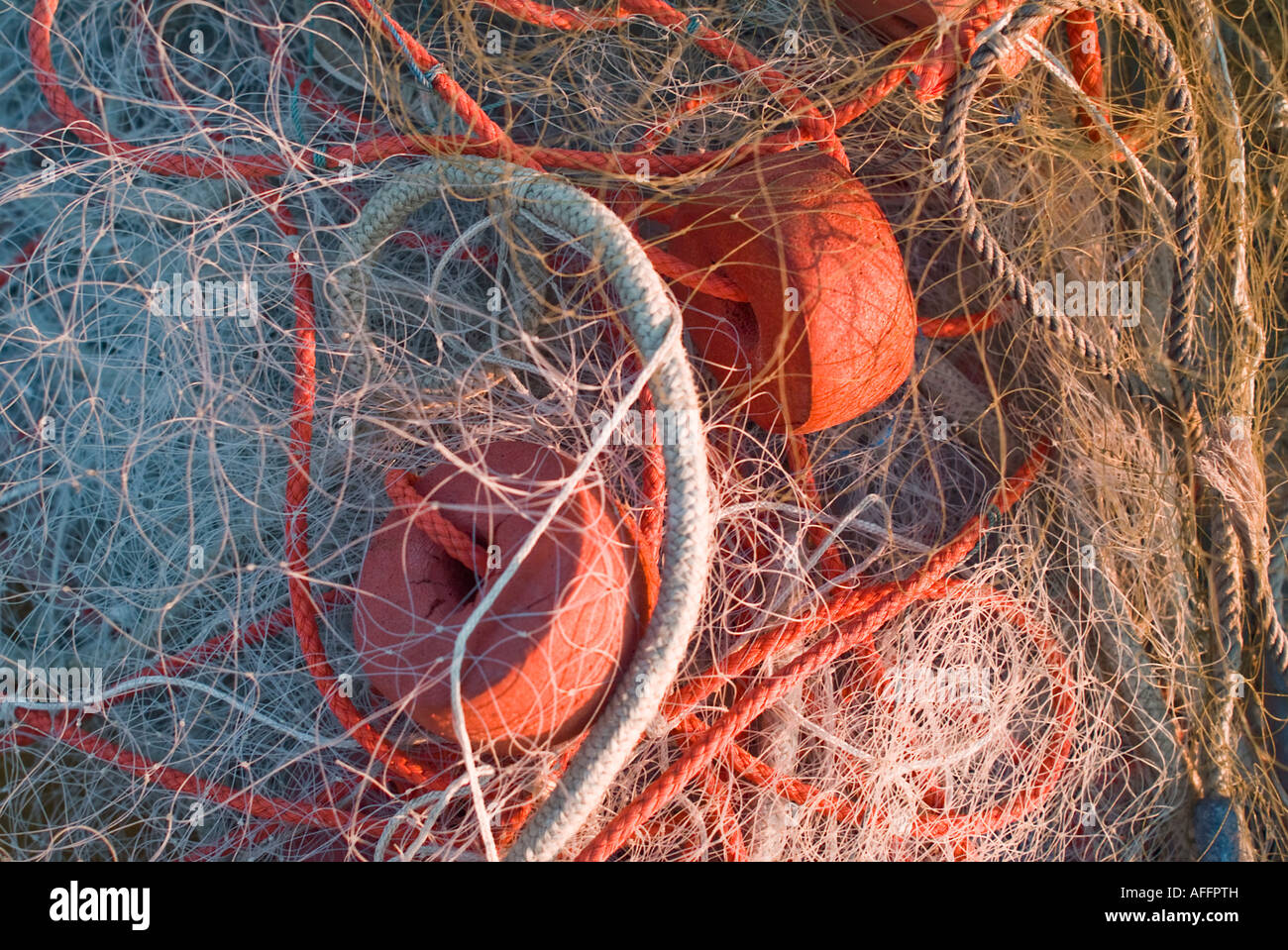 Tangled buoy rope and fishing net Stock Photo - Alamy