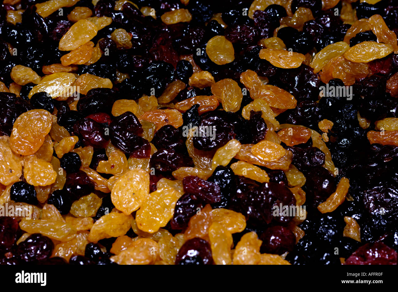 Dried light and dark raisins mixed lose in market stall Stock Photo - Alamy