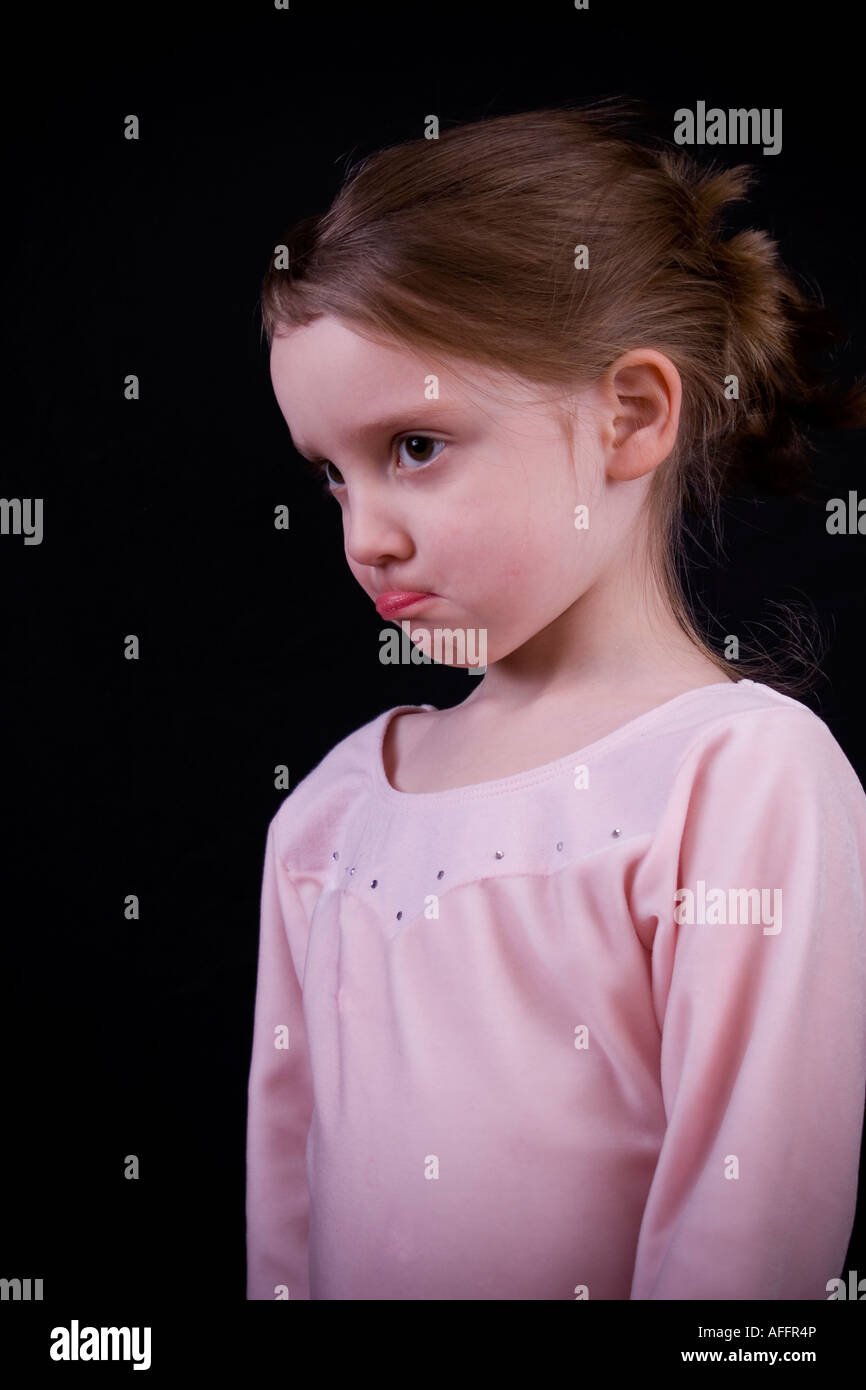 Little girl sticking out her lower lip in a defiant pout Stock Photo ...