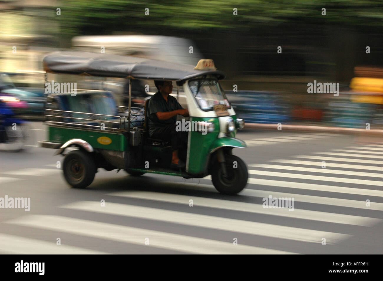 Panning view of a moving Tuk-Tuk / Rickshaw, Bangkok, Thailand Stock ...