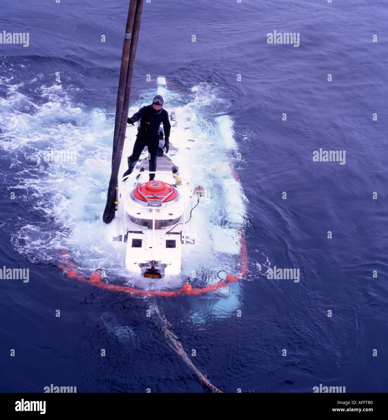 LR5 submersable submarine rescue vessel being lowered into the sea ...