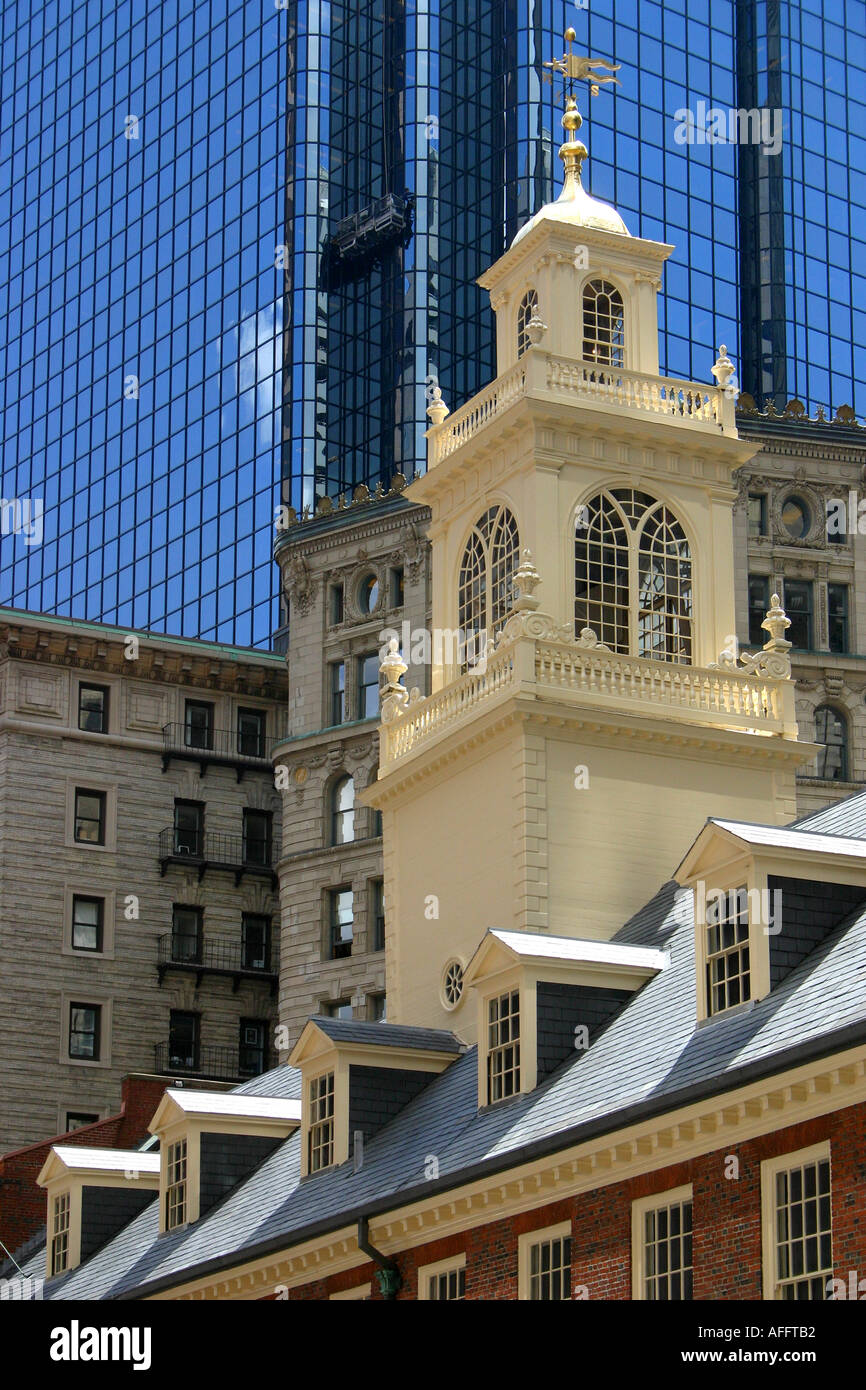 New and old A reflective glass skyscraper rising above the Old State ...