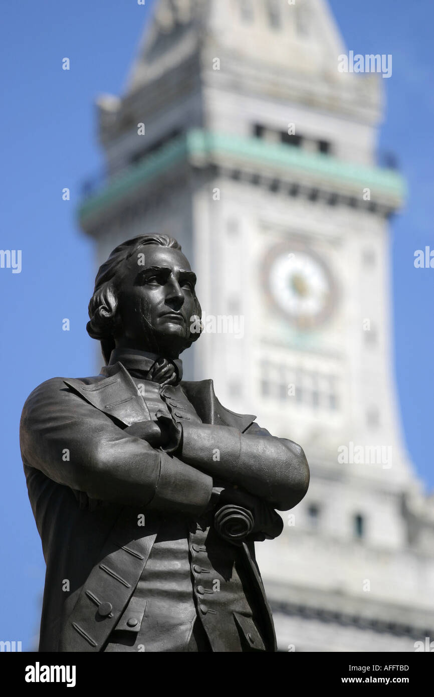 A statue of Samuel Adams and the Custom House Tower in Boston ...