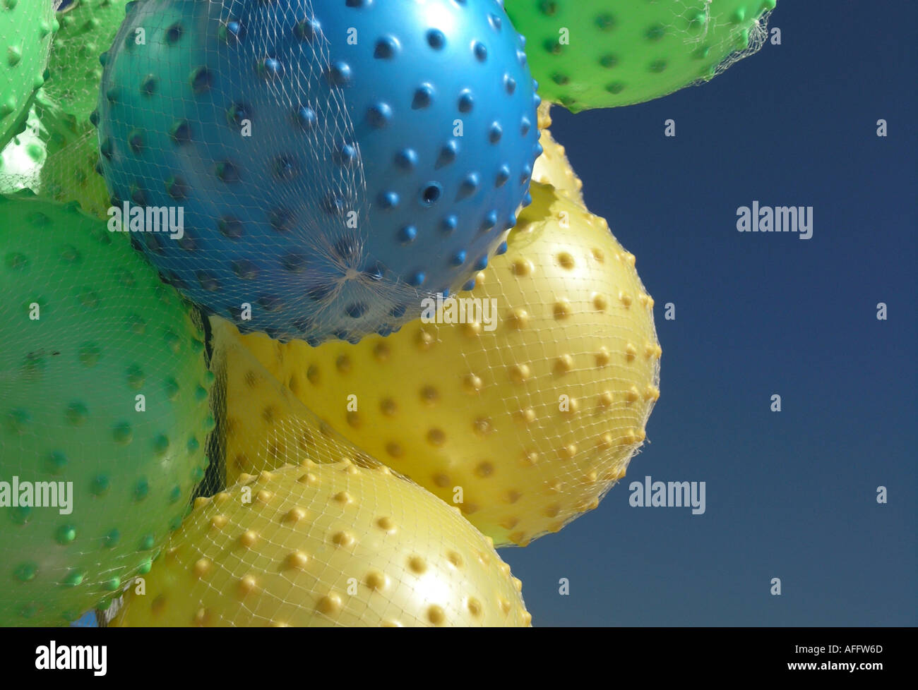 Beach balls in a net back Stock Photo - Alamy