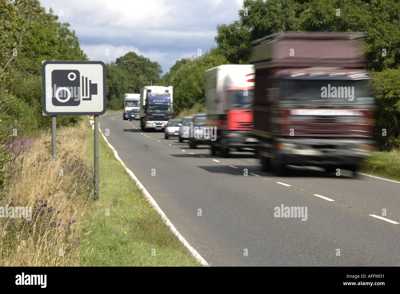 Traffic passing speed camera sign Stock Photo - Alamy