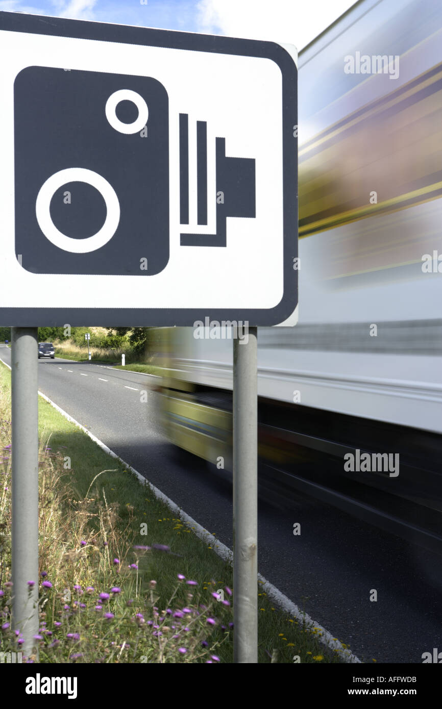 Lorry passing speed camera sign Stock Photo - Alamy