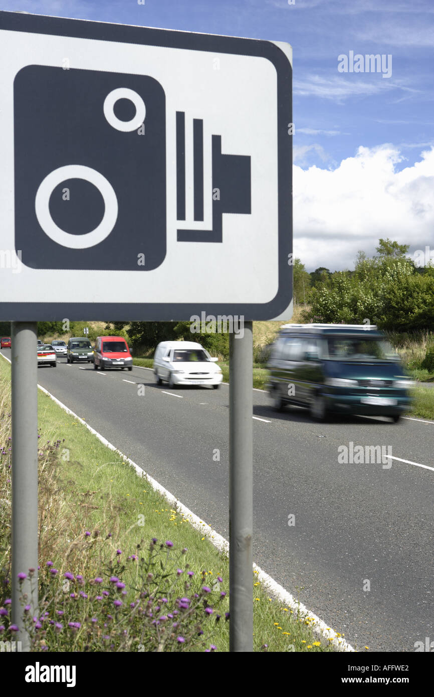 Traffic on the A75 passing speed camera sign Stock Photo - Alamy