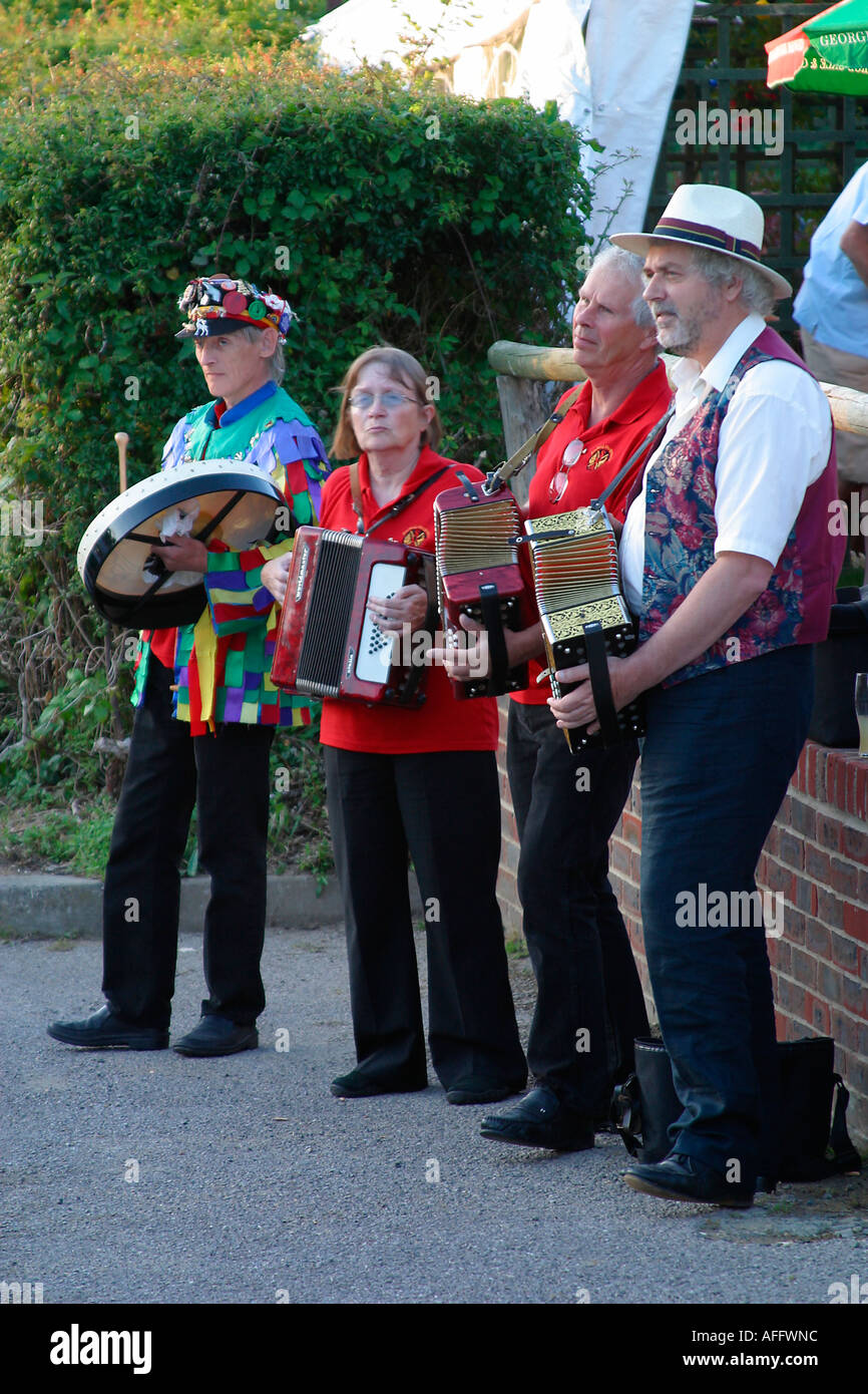Musicians playing for Morris Dancing troupe on a summers evening ...
