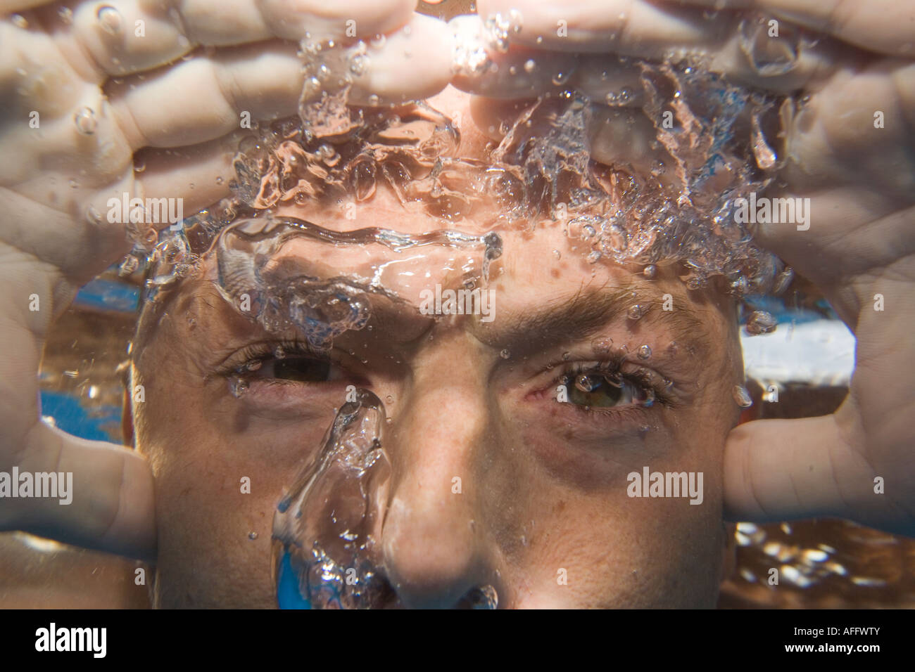 Man under water looking for something Stock Photo - Alamy