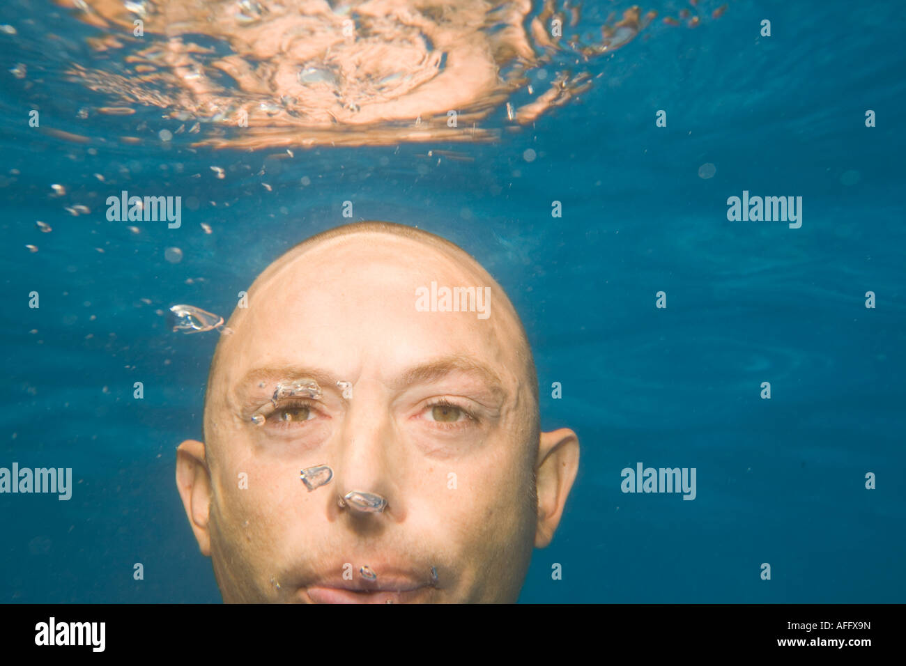 Man under water Stock Photo - Alamy