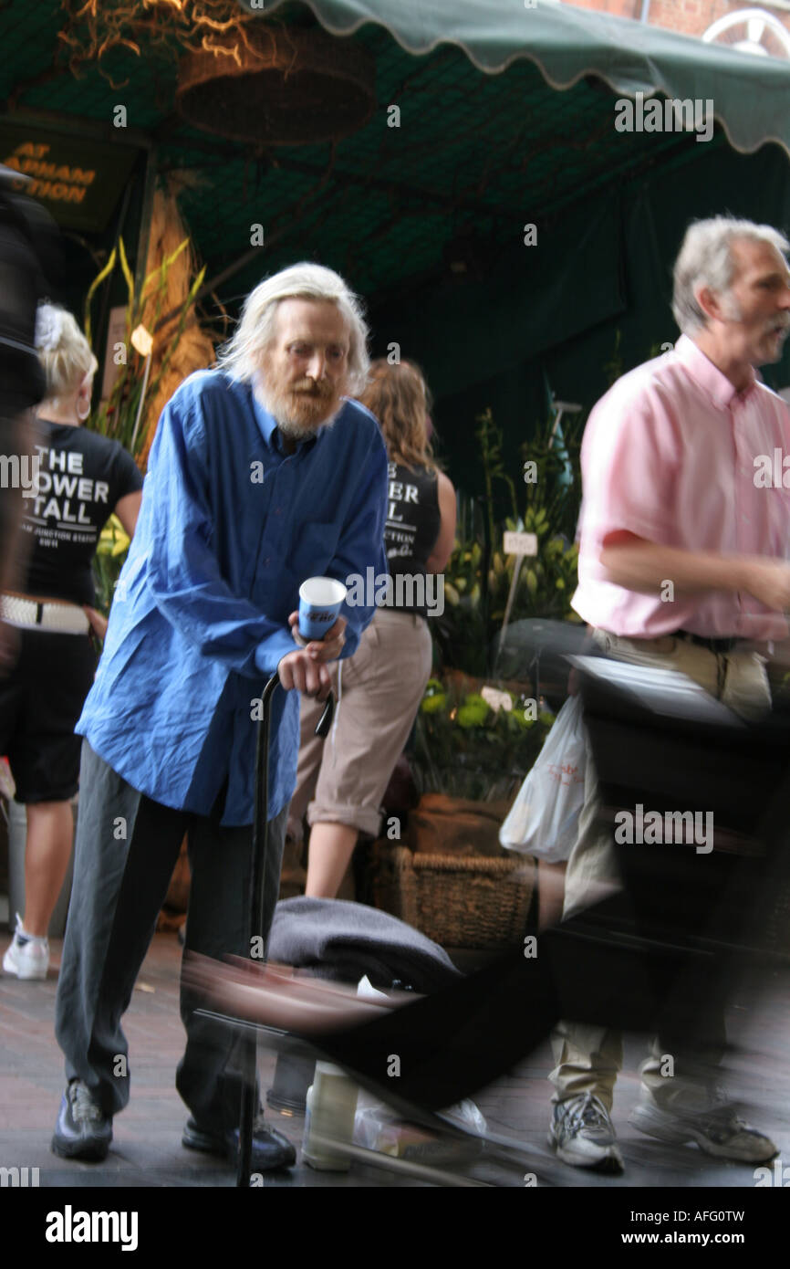 Homeless man begging Stock Photo - Alamy