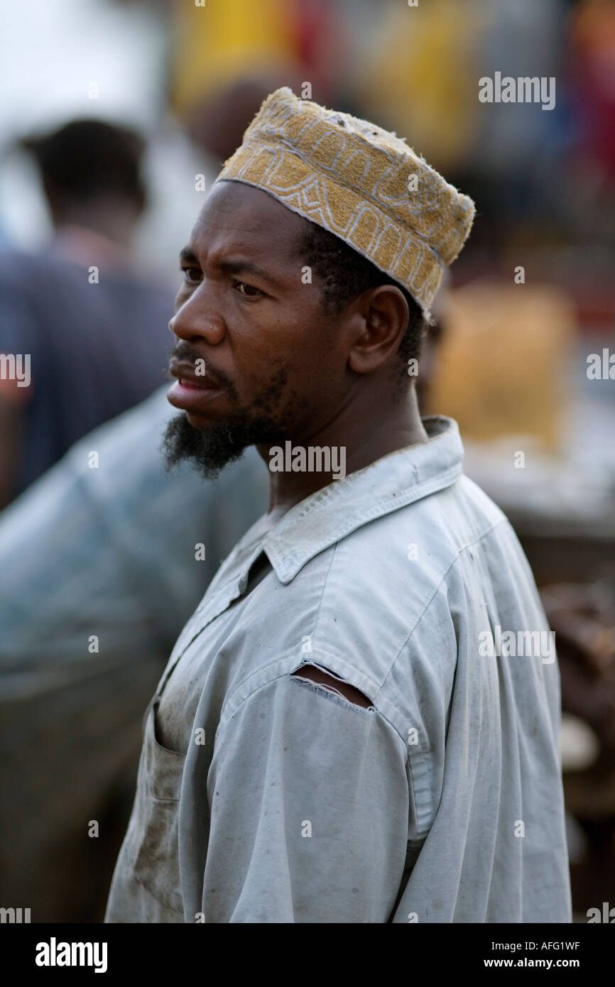 Man in traditional clothing at the Stone Town Fish Market in Zanzibar ...