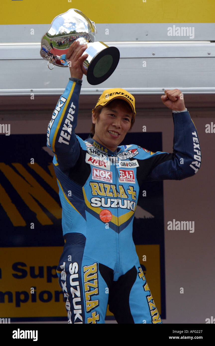 Yukio Kagayama rizla suzuki racer holds up the winners trophy after ...