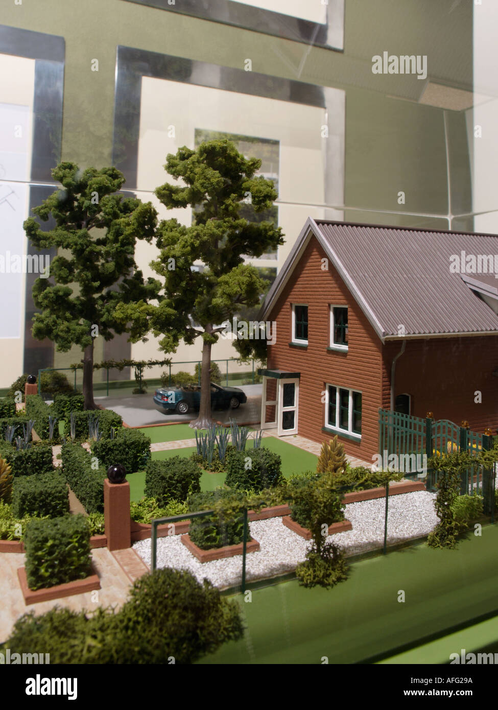 Scale model of a new house complete with nice garden and mortgage Stock ...