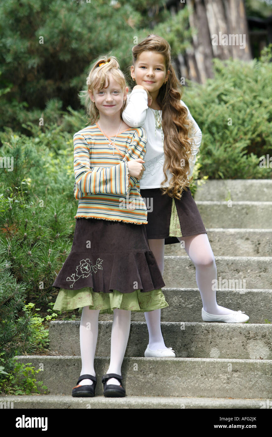 Two little girls posing Stock Photo - Alamy
