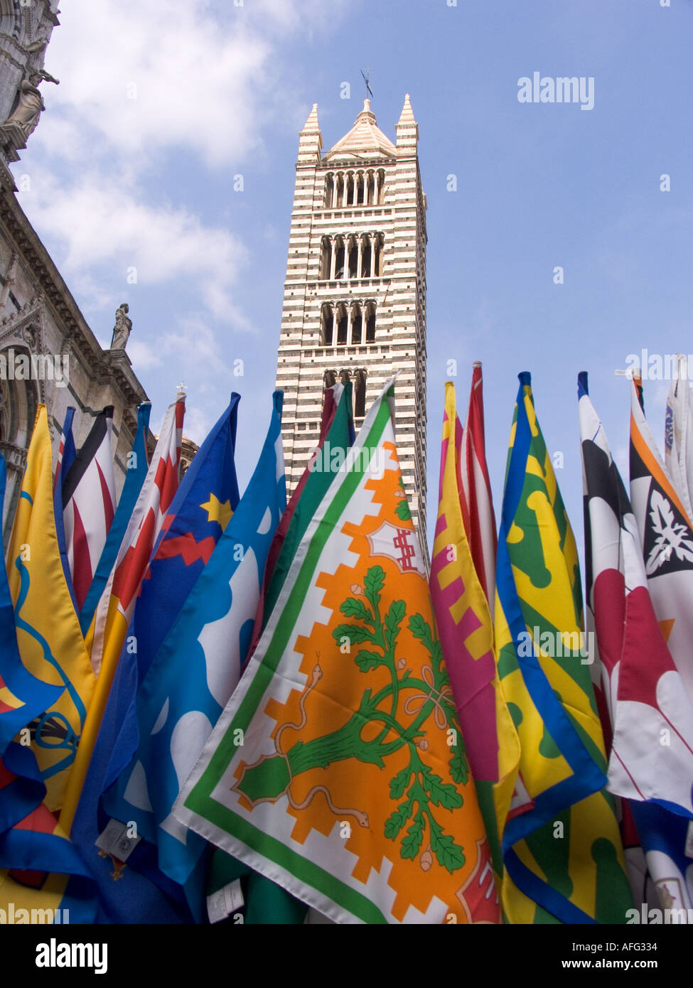 Colorful flags and the campanile of the Duomo Siena Italy Stock Photo ...