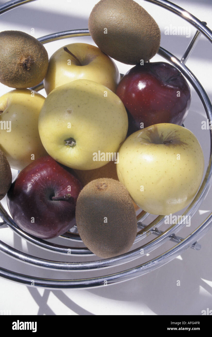 Fruit in Stainless Steel Wire Bowl on a Table in the Sunshine Stock ...