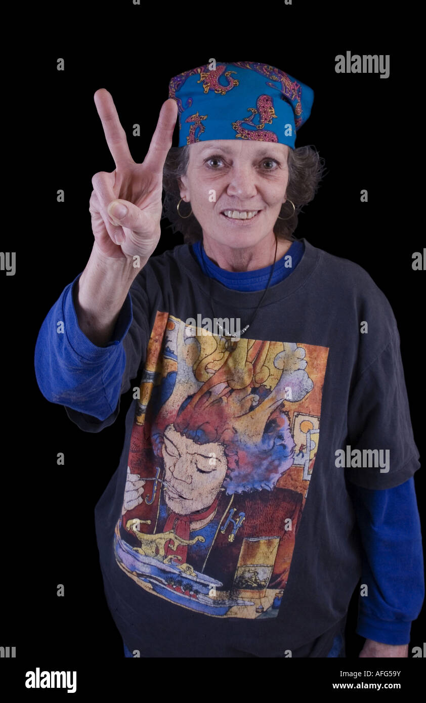 Older woman making peace sign hi-res stock photography and images - Alamy