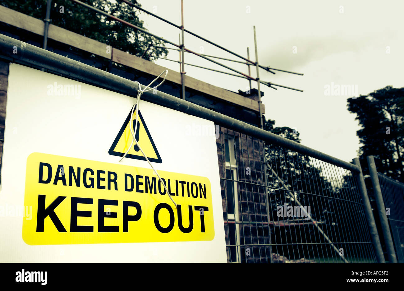Danger Demolition Keep Out warning sign on building demolition site ...