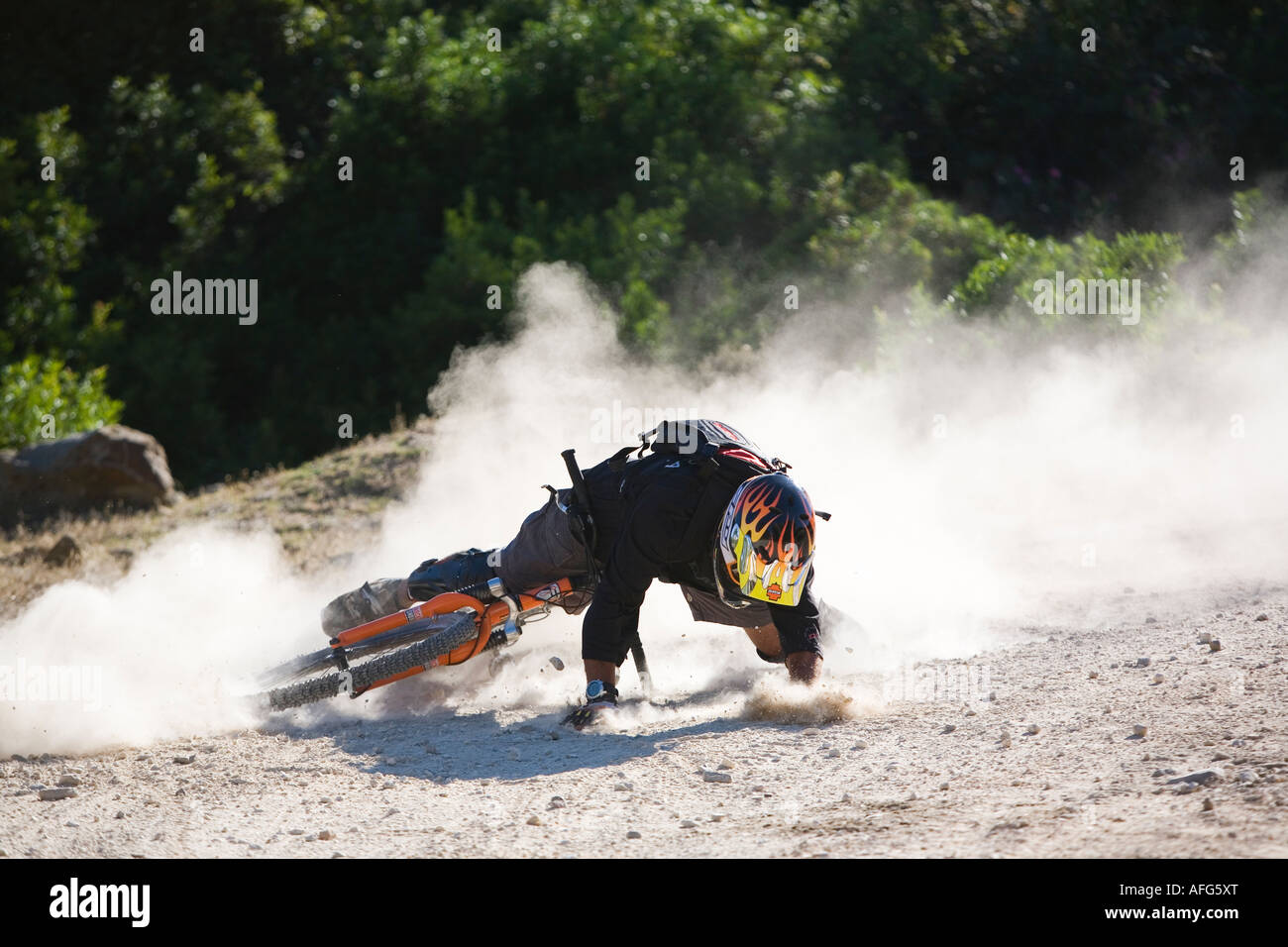 Mountain Biker Falling off his bike Stock Photo - Alamy