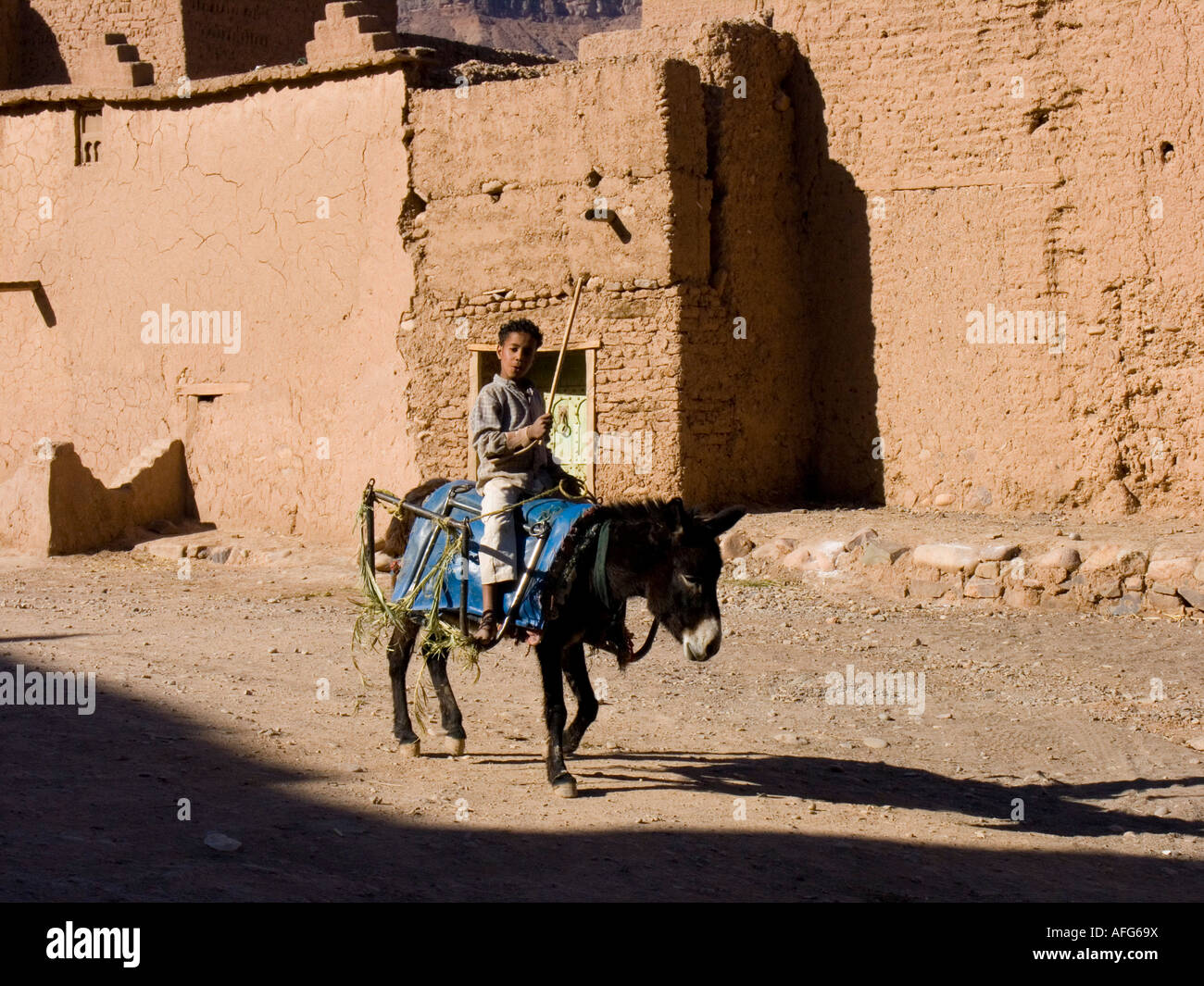 Child riding a donkey africa hi-res stock photography and images - Alamy