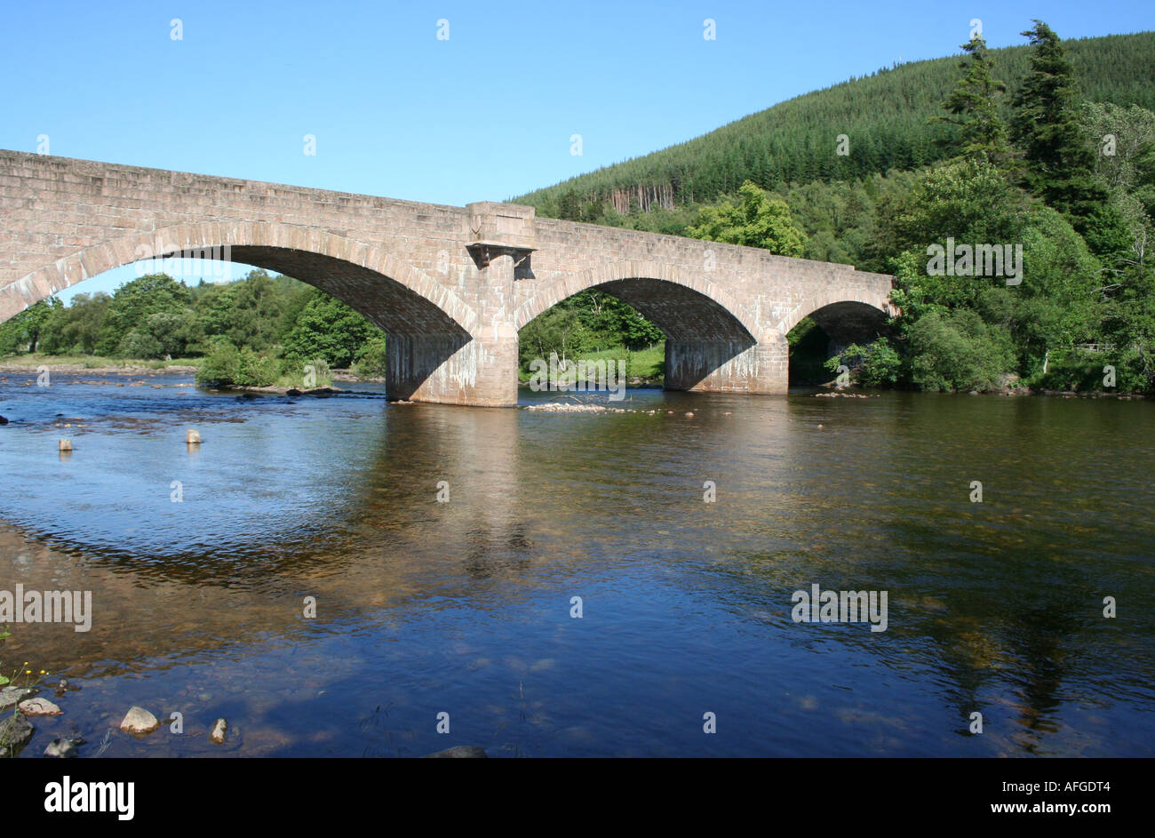 Arched stone bridge over River Dee Ballater Scottish Highlands July ...