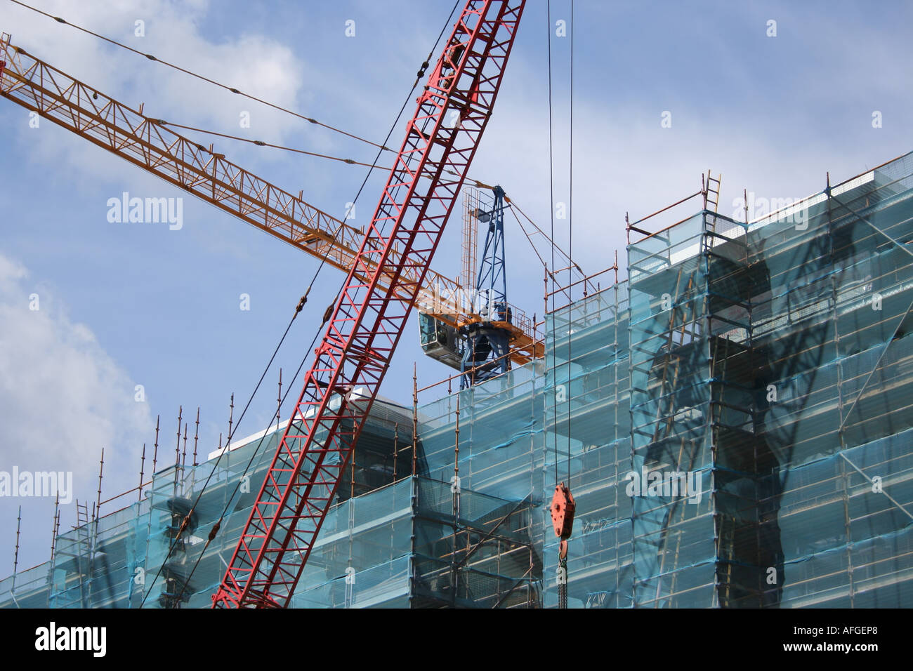 Construction cranes at building sites Stock Photo - Alamy