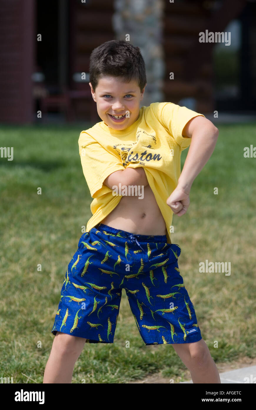 Young boy being silly doing funny armpit sounds Stock Photo - Alamy