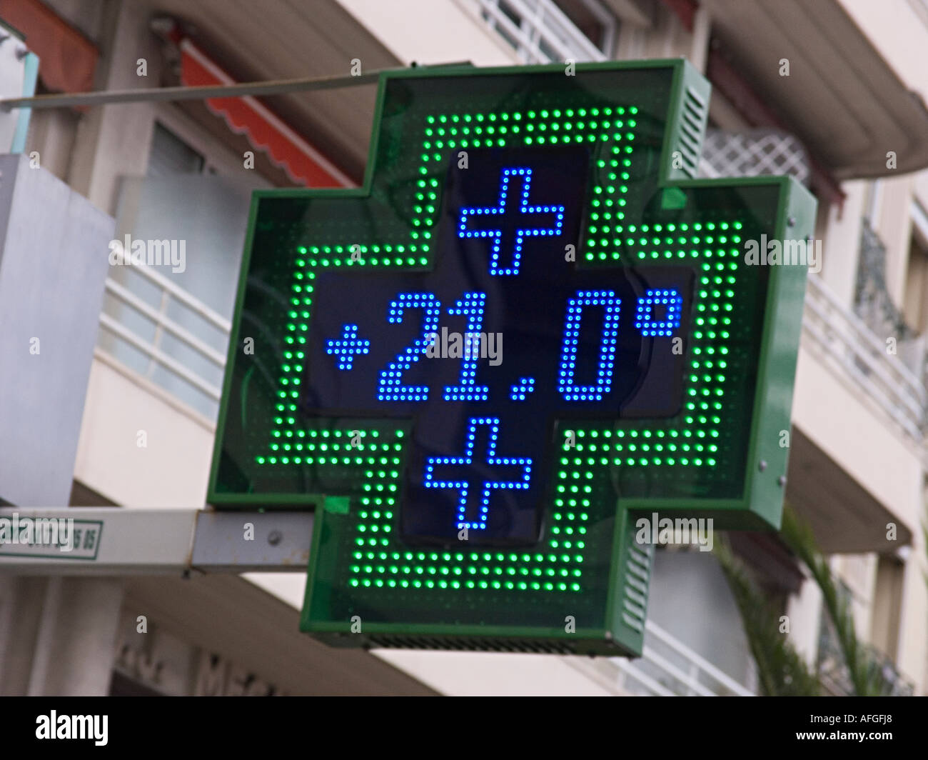A pharmacy's illuminated sign indicates the ambient temperature - Nice ...