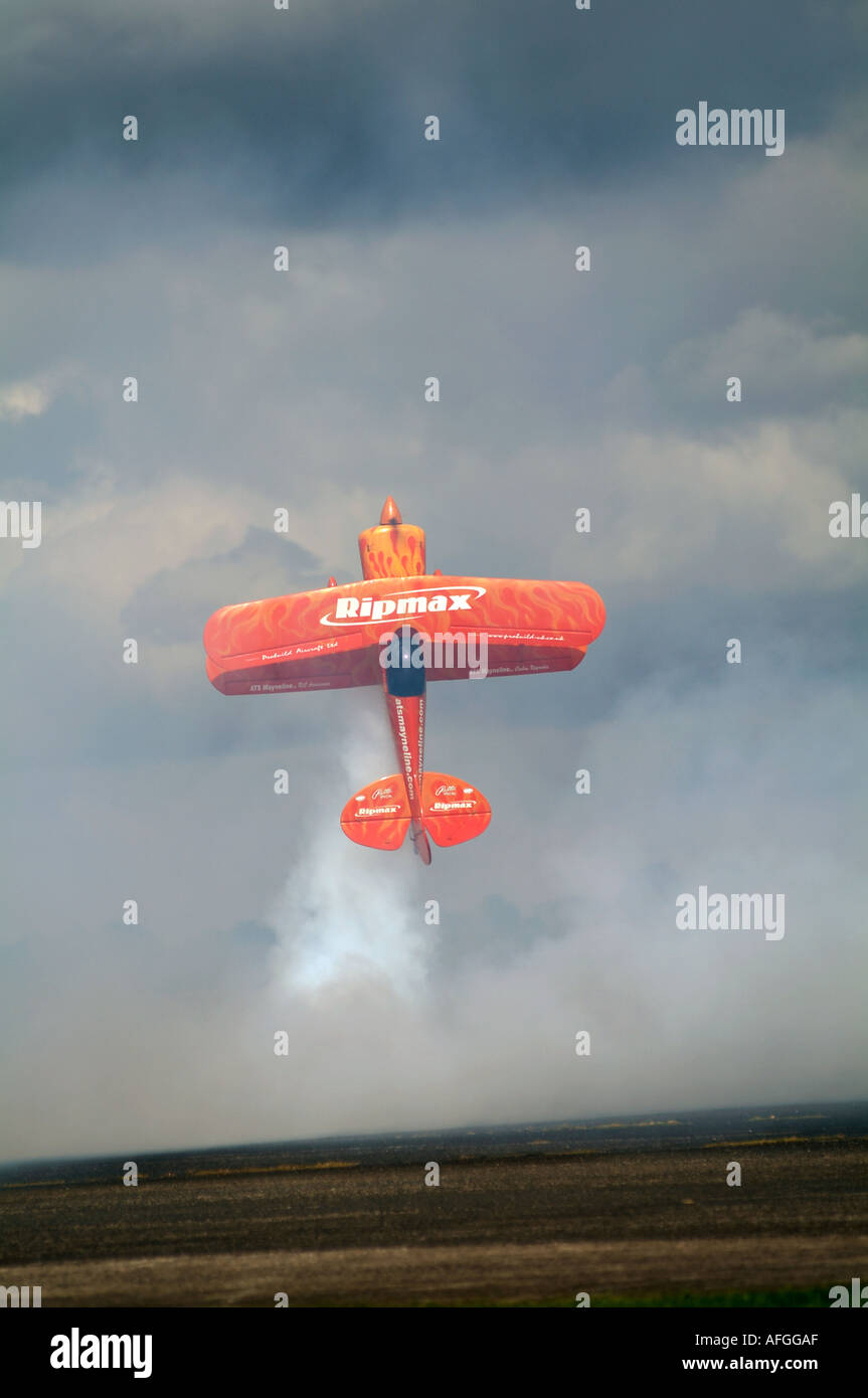 Radio controlled stunt plane performing an aerobatic display loop the ...